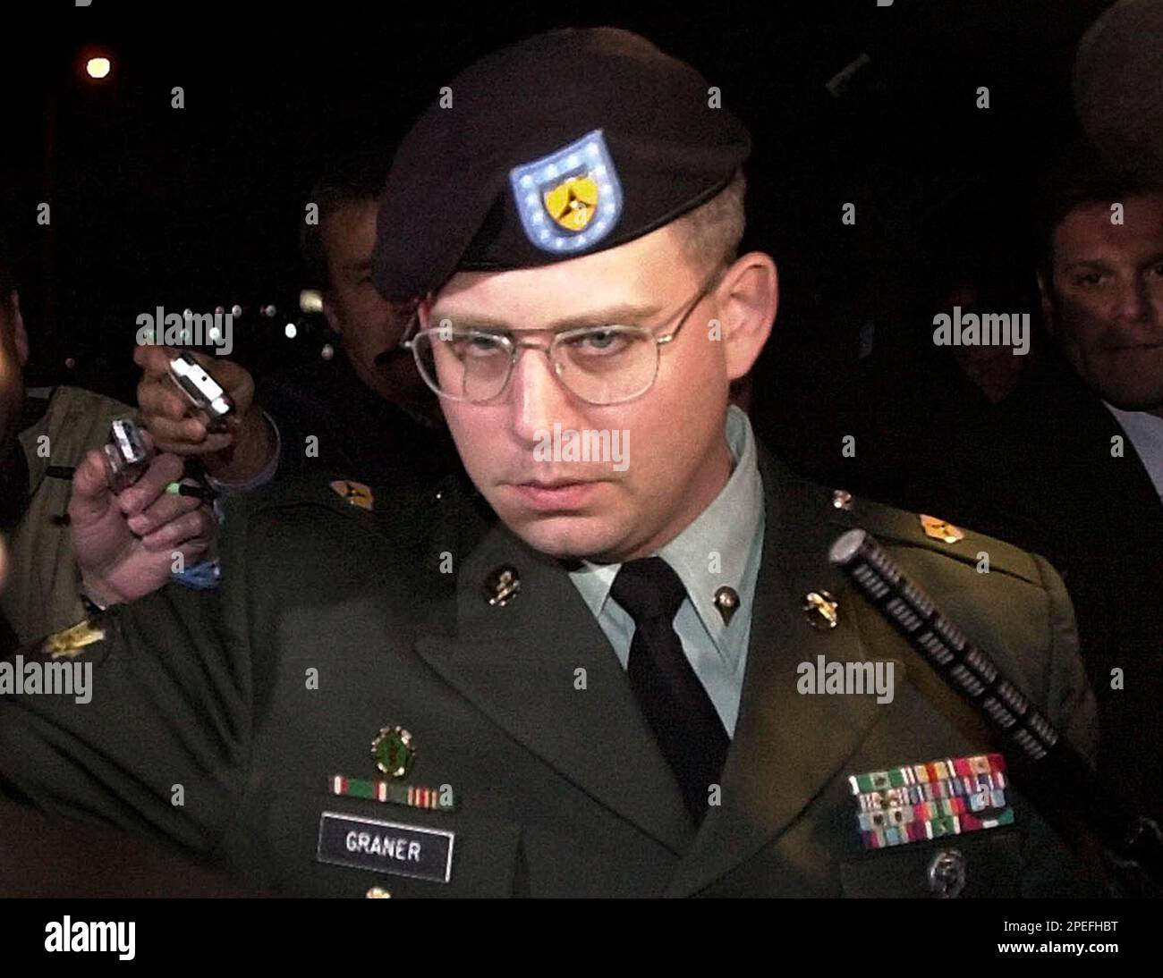 Army Spc. Charles Graner Jr., center, walks with his attorney, Guy ...