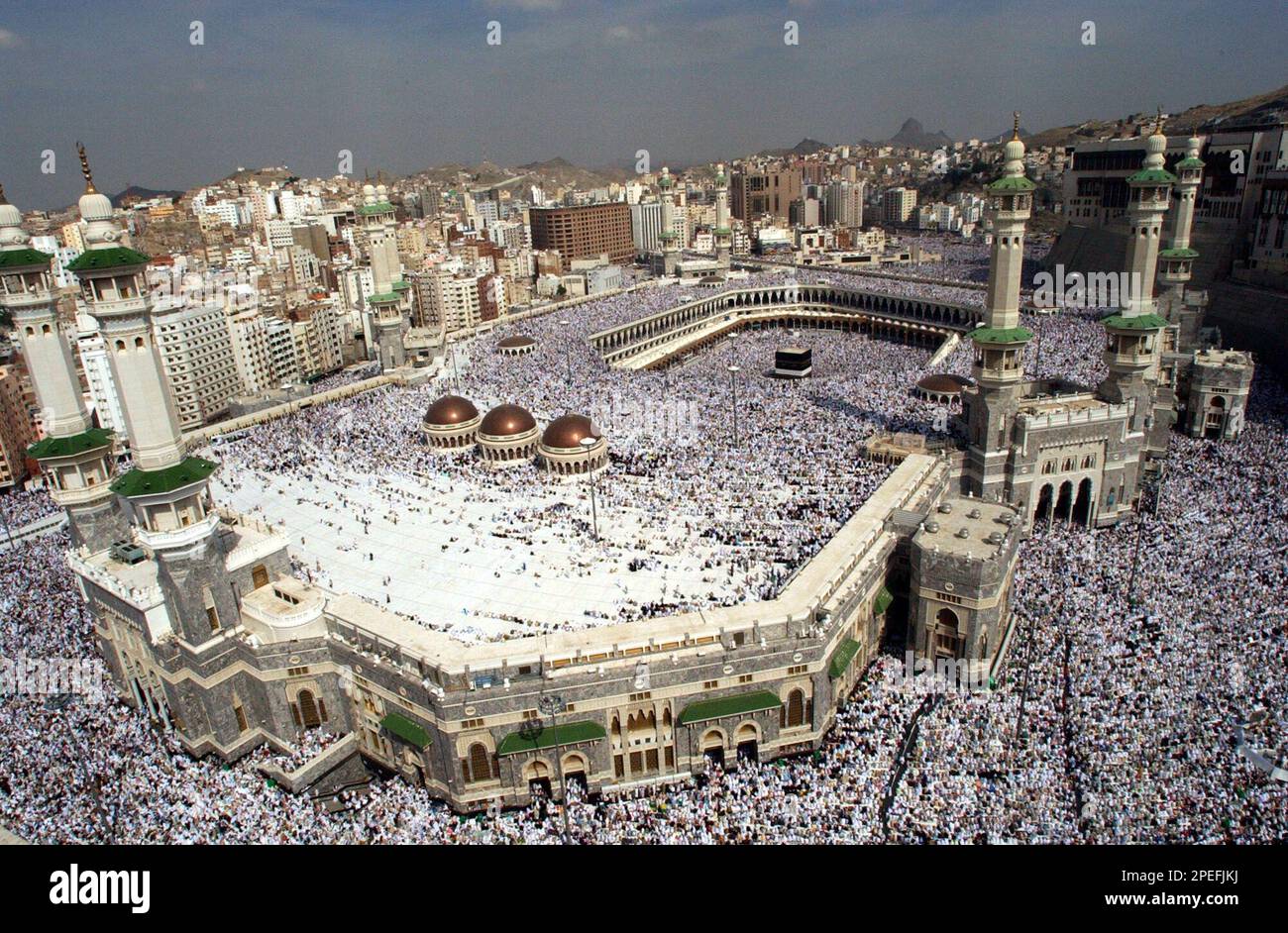 Milions of pilgrims perform Friday prayers at the great mosque in Mecca ...