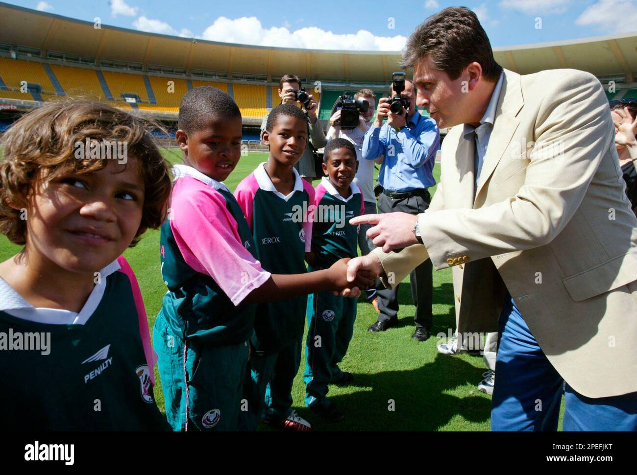 Bulgarian President Georgi Parvanov, right, greets Brazilian children ...