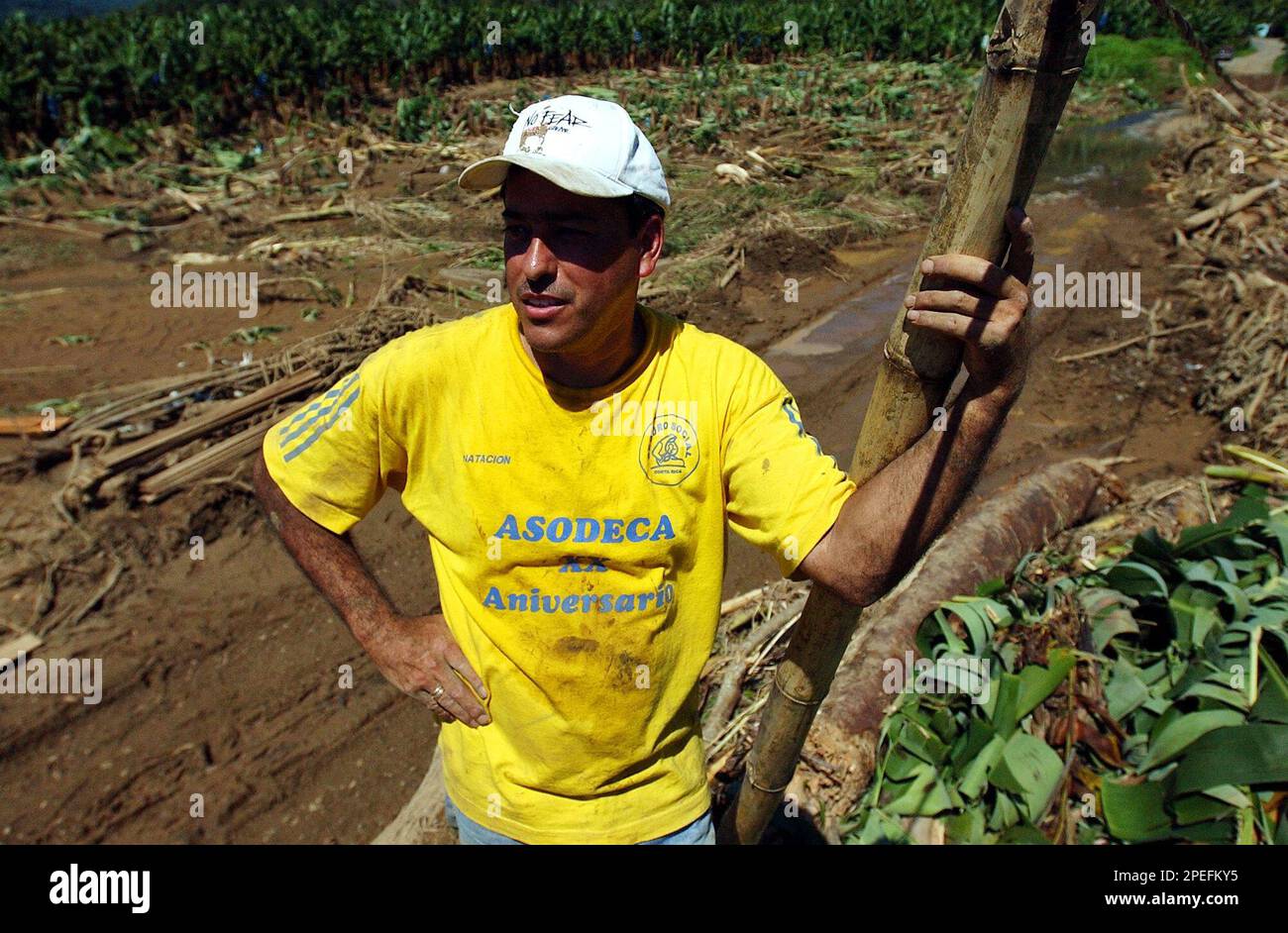Costa Rican Melvin Robles looks out over the damage after surging flood ...