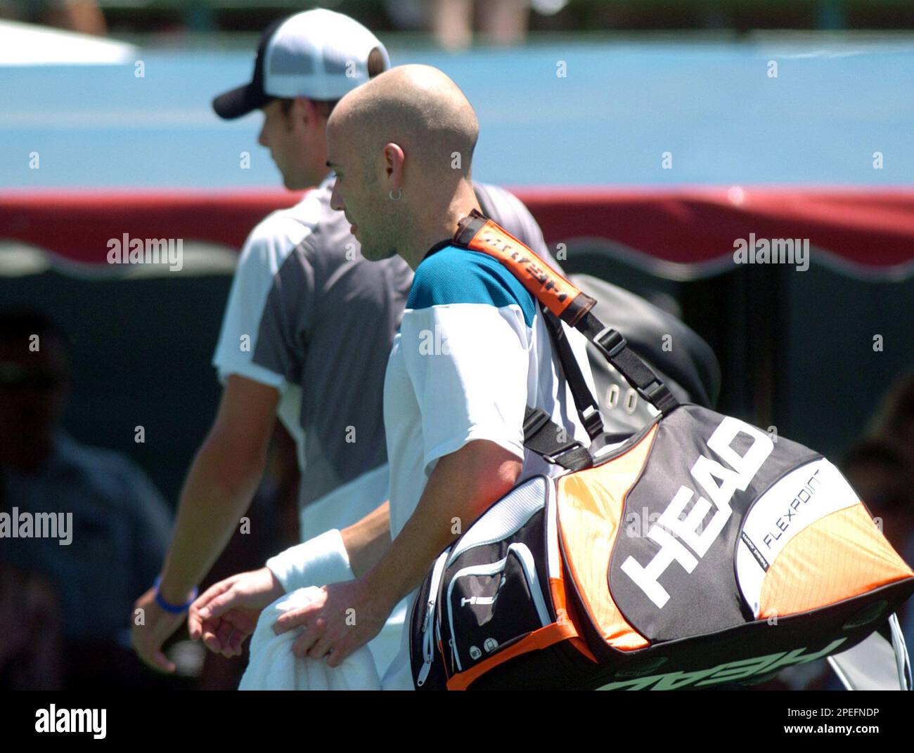 American Andre Agassi leaves the court with fellow countryman Andy ...