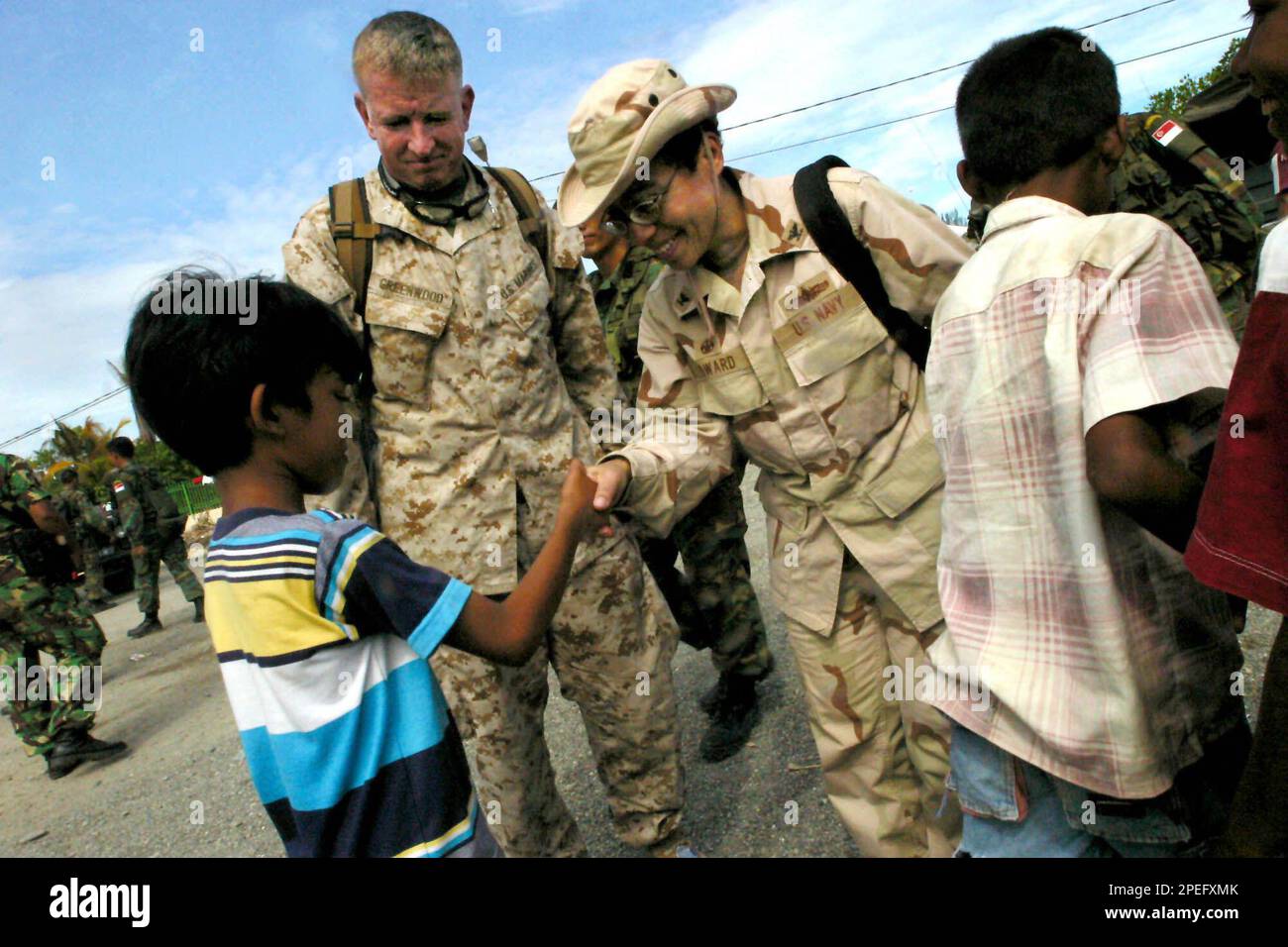 Col. Tom Greenwood from the U.S. Marine Corps, left, and Capt. Michelle ...