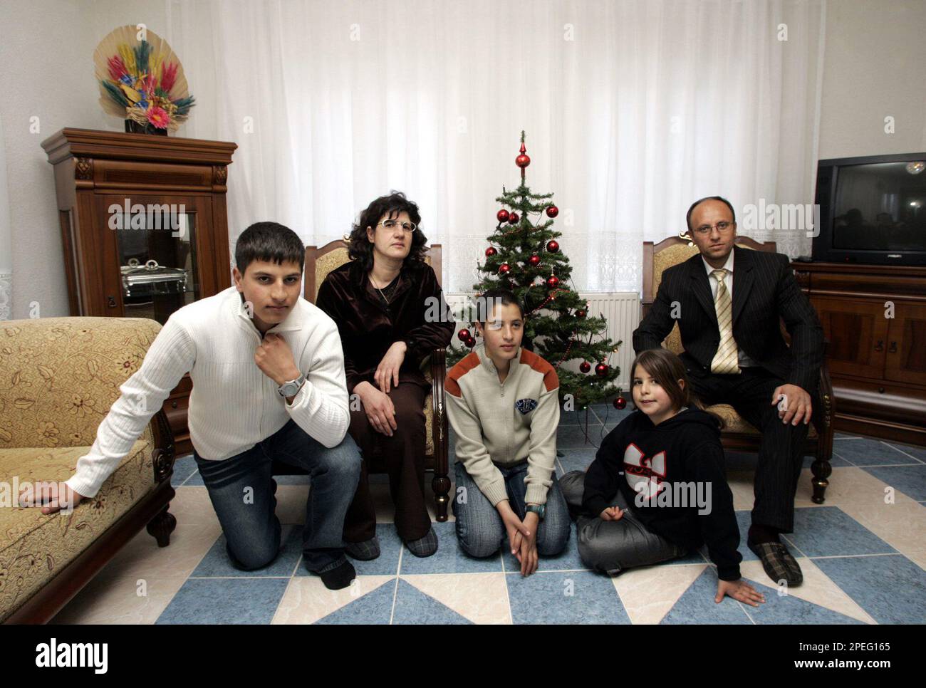 The Saliba family left to right: Stefan, Sara, Marcus, Ninua and Erden pose in front of their ...