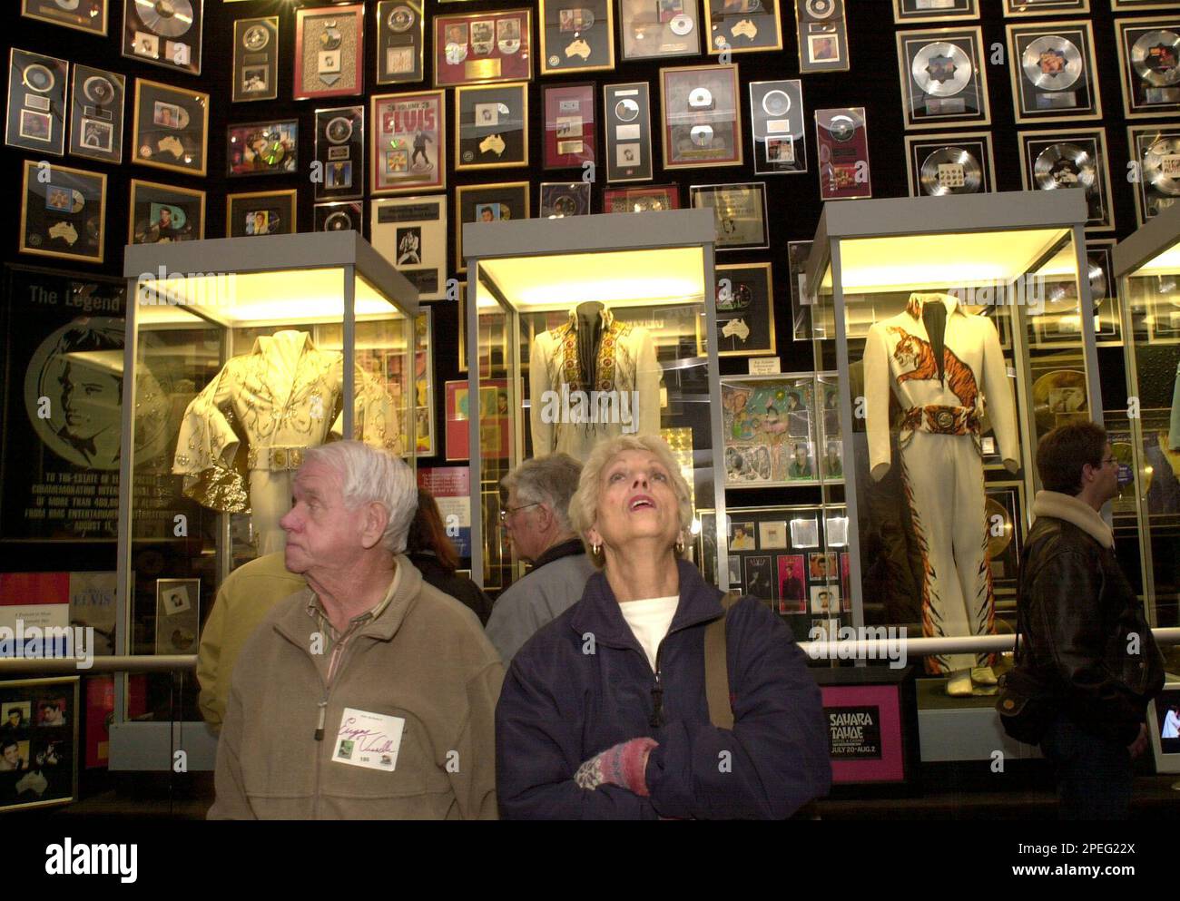 Eugene and Sybil Vessels from Dallas, look over the many gold records ...