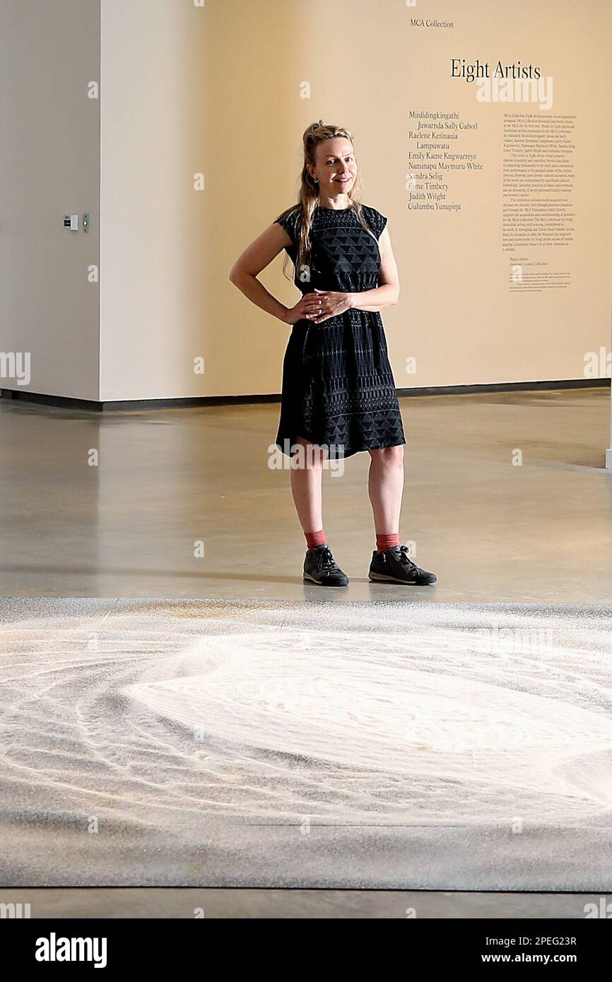 Artist Sandra Selig poses for a photograph alongside her art ...