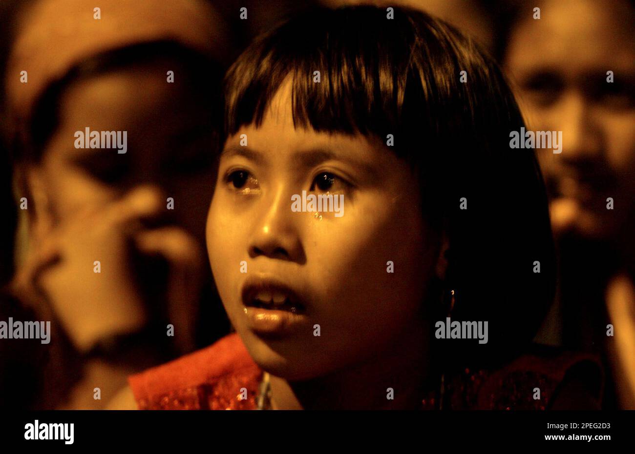 A tsunami affected Nicobari girl, from Car Nicobar, sheds tears as she ...