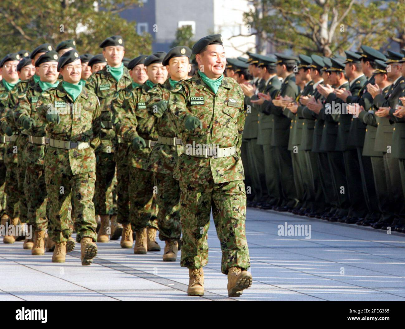Japan Ground Self Defense Forces Col. Kimihito Iwamura, center, leads ...