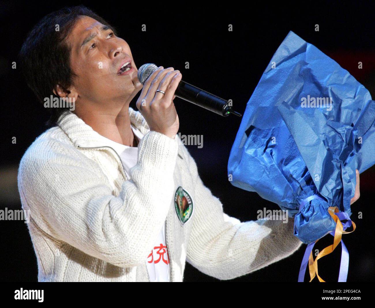 Taiwanese singer Chi Chyn performs during a charity concert for Tsunami ...