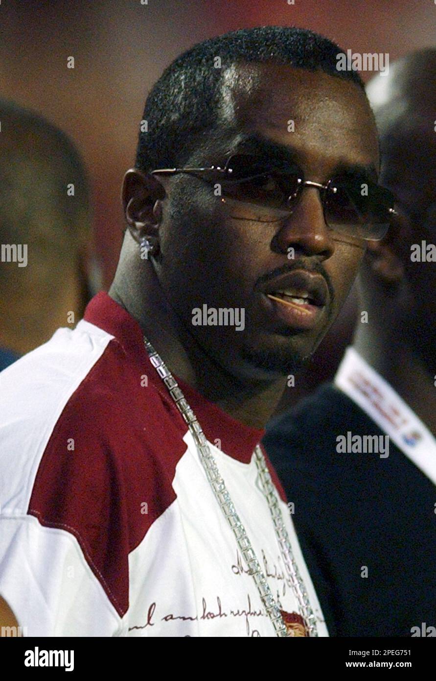 Entertainer Sean "P. Diddy" Combs watches the Orange Bowl between ...