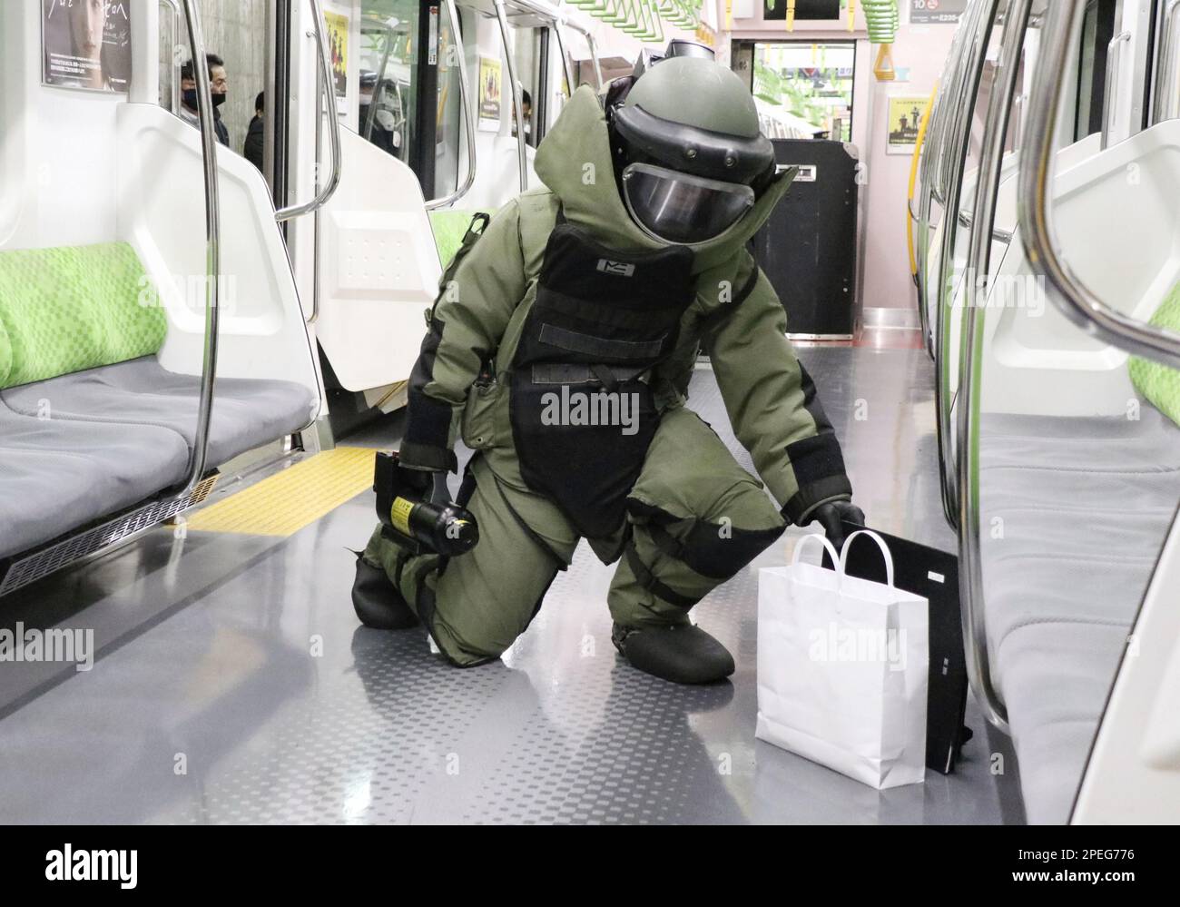 A member of an anti-terrorist unit looks for a suspicious object during ...