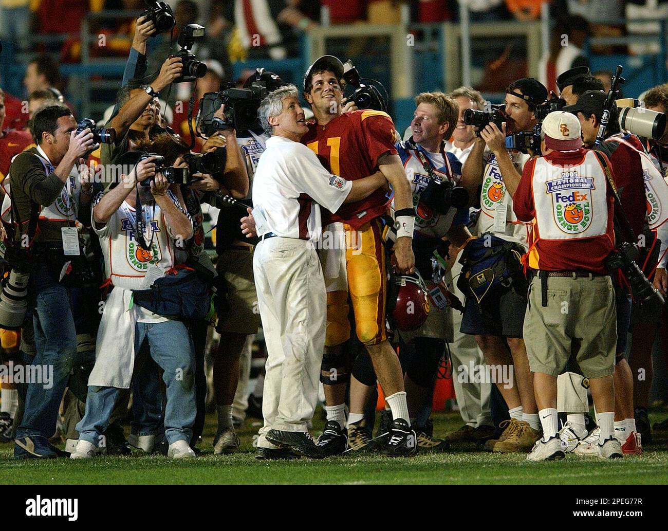 Southern Cal coach Pete Carroll and quarterback Matt Leinart embrace ...