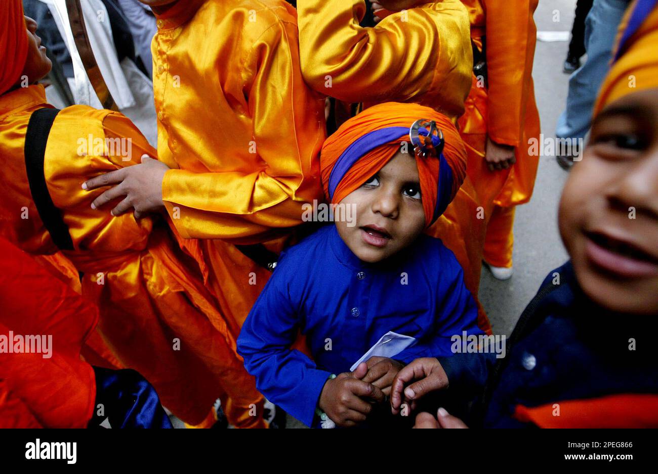 School children dresses up as baptized Sikhs participate in a religious ...