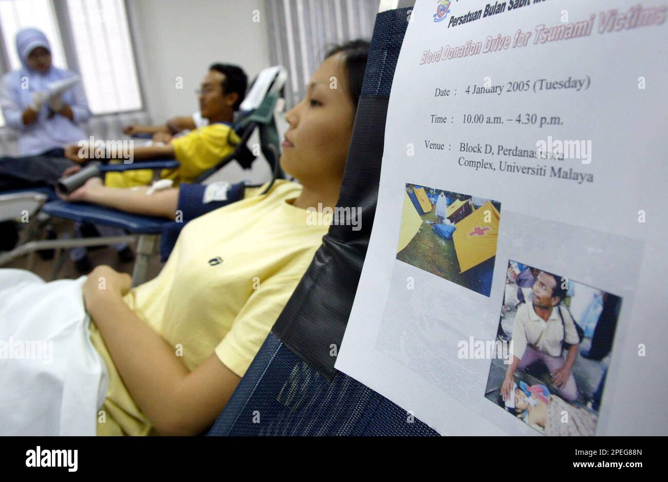 University students donate blood for tsunami victims at a Kuala Lumpur ...