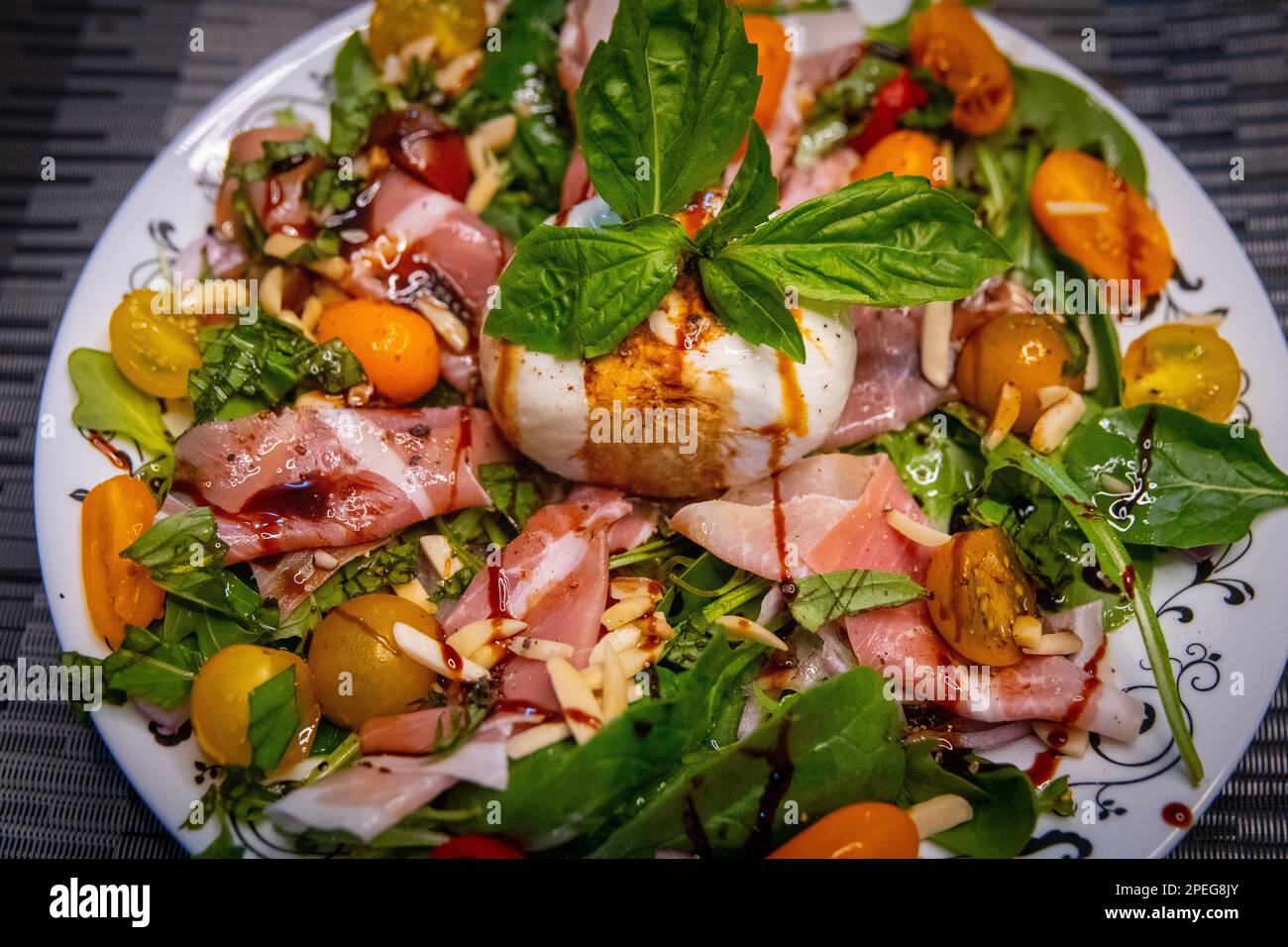 Fresh burrata on salad hi-res stock photography and images - Alamy