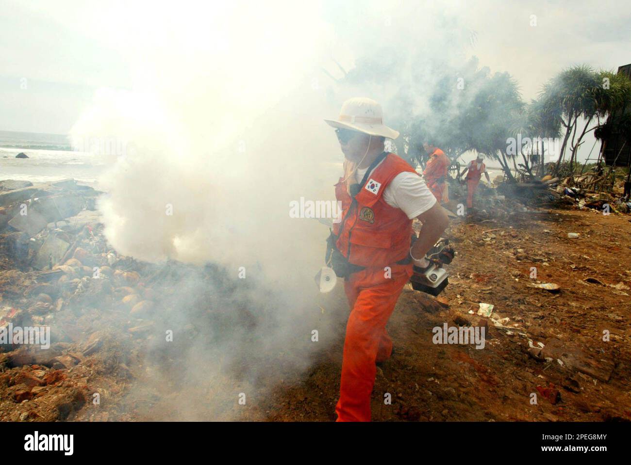 Joining the international relief effort, Korean rescue workers sprayed ...