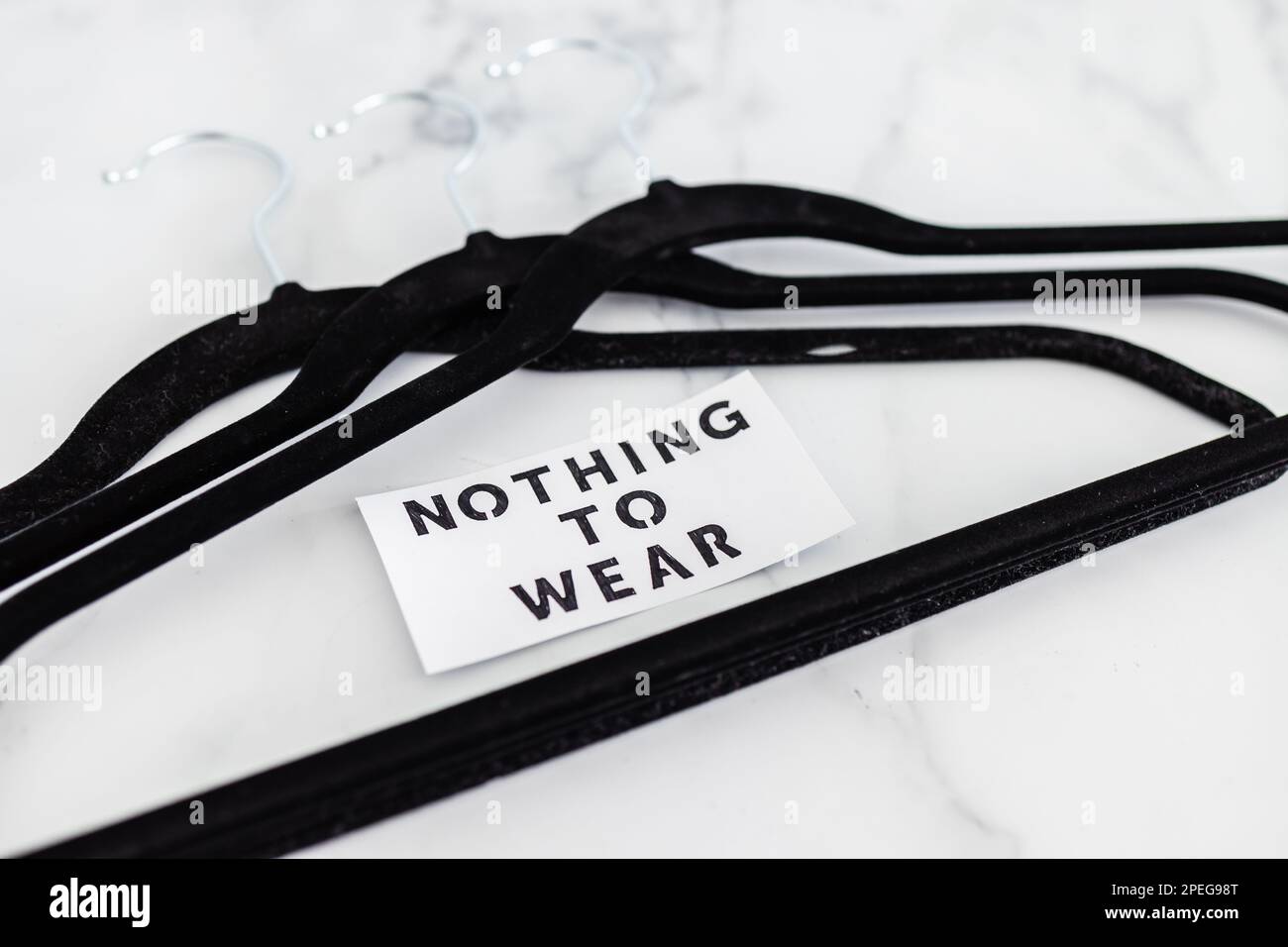 fashion and shopping concept, Nothing To Wear text on group of empty ...