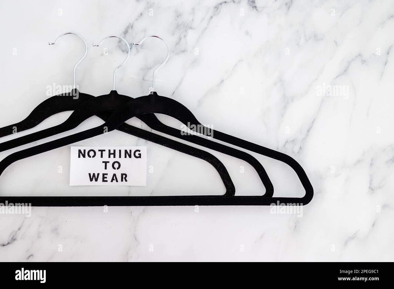 fashion and shopping concept, Nothing To Wear text on group of empty ...