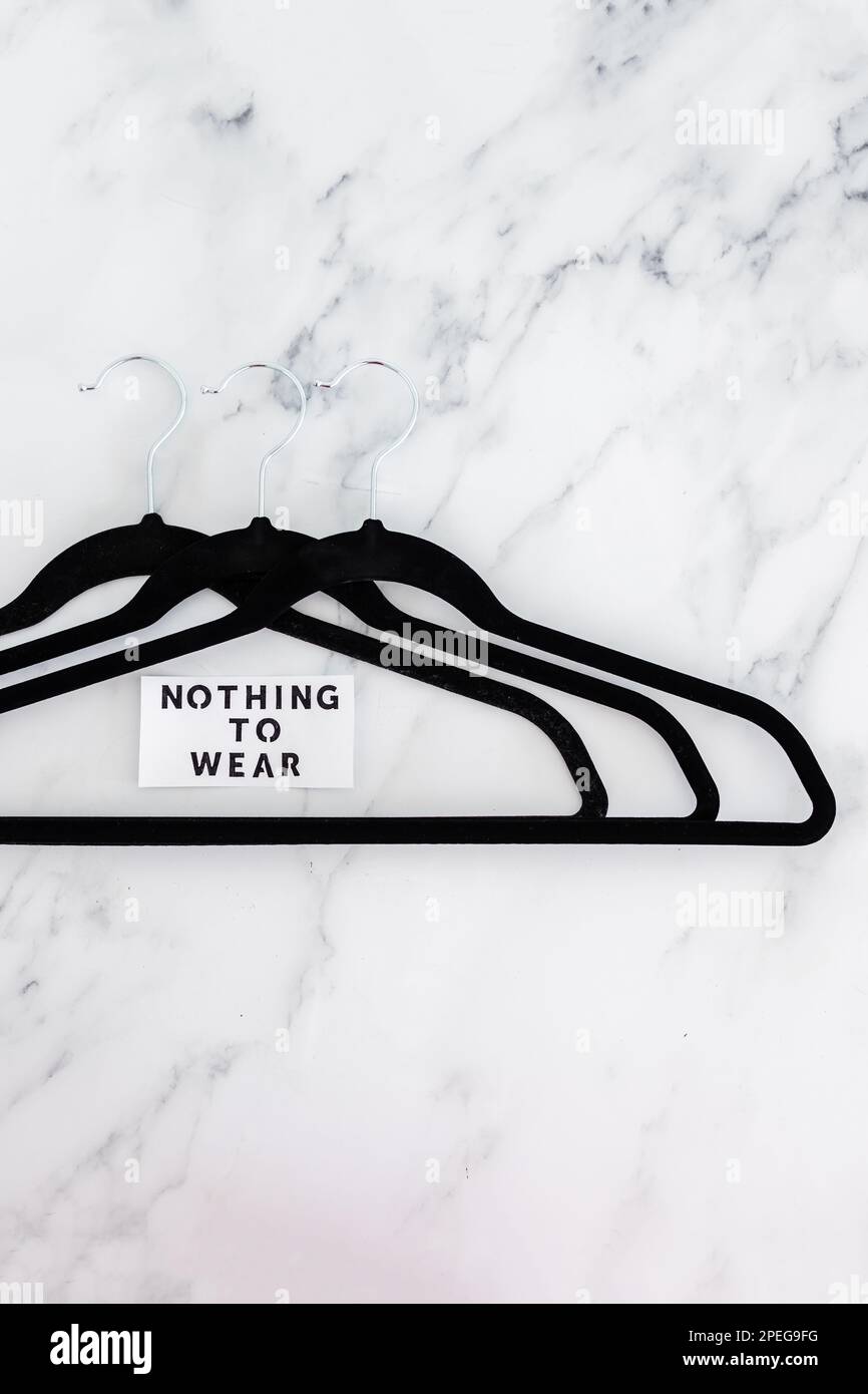 fashion and shopping concept, Nothing To Wear text on group of empty ...