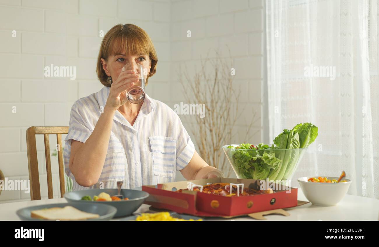 Elderly retired grandmother stay at home with unhappy face sitting ...