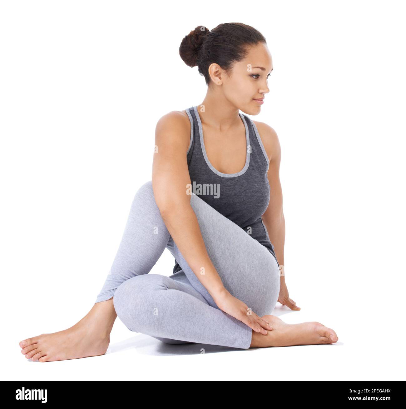 Making sure every muscle stays flexible. A gorgeous young woman in ...