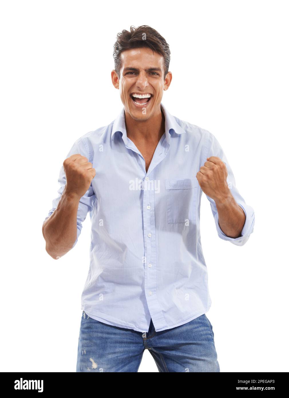 Yes I did it. Portrait of a handsome young man cheering with his fists ...