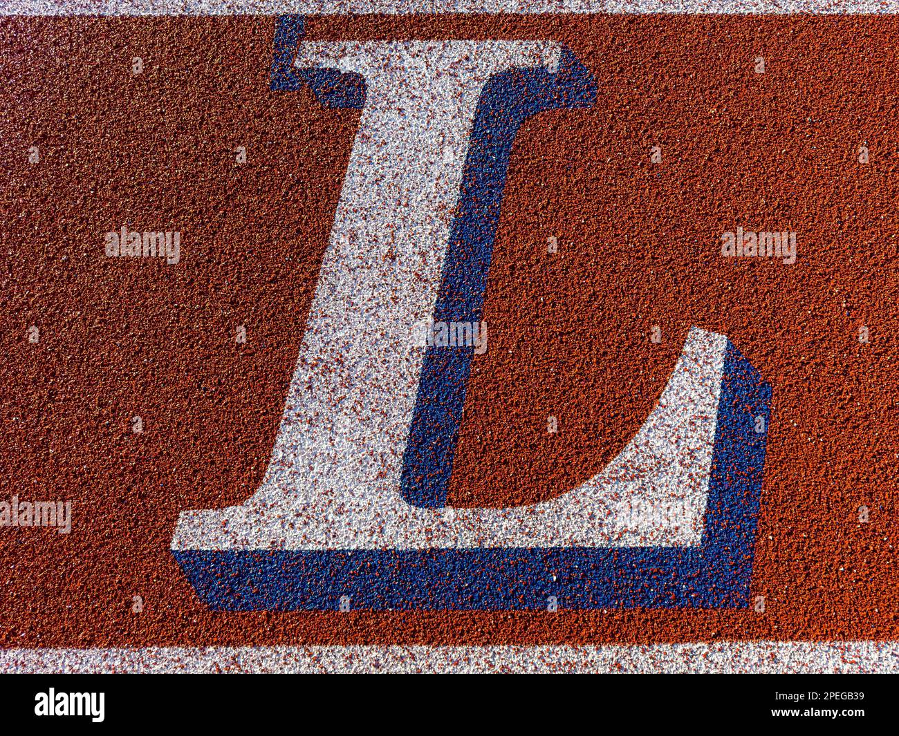 Close up of the letter L on new red running track with white lane lines ...
