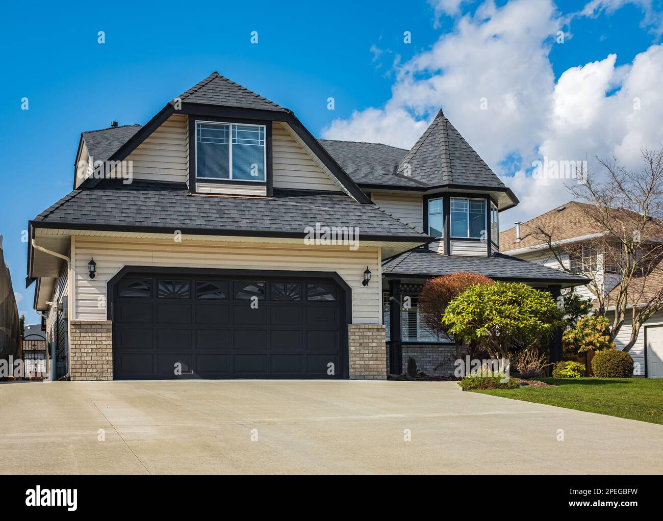 Real Estate Exterior Front House on a sunny day. Big custom made luxury ...