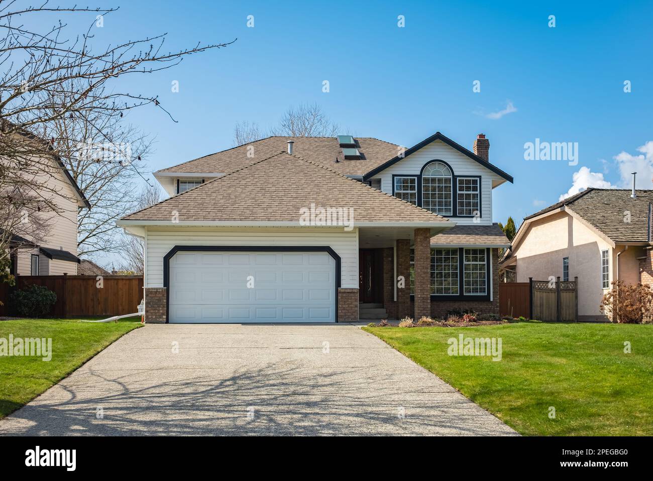 Real Estate Exterior Front House on a sunny day. Big custom made luxury ...