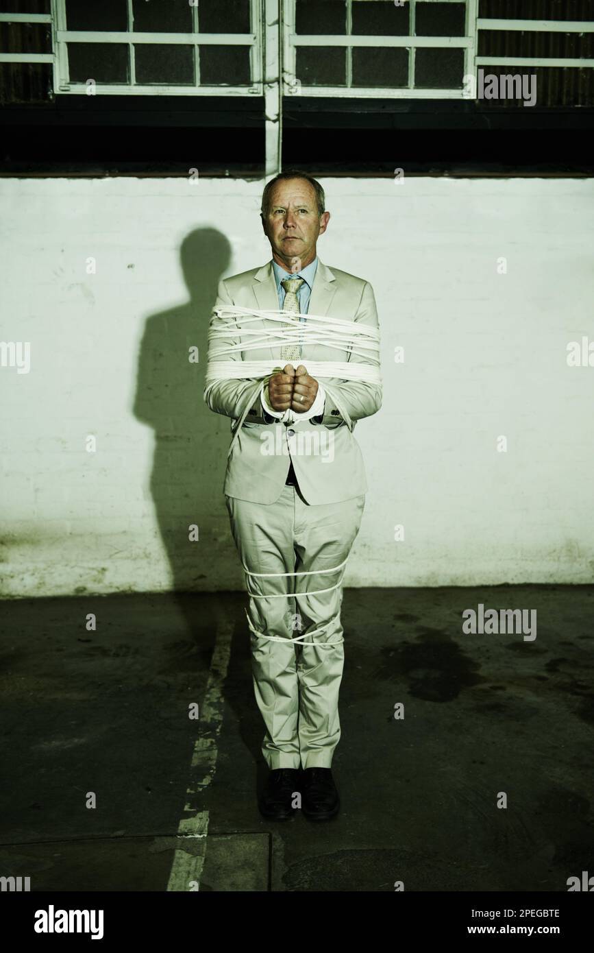 Kidnapped and held to ransom. A businessman tied up after being ...