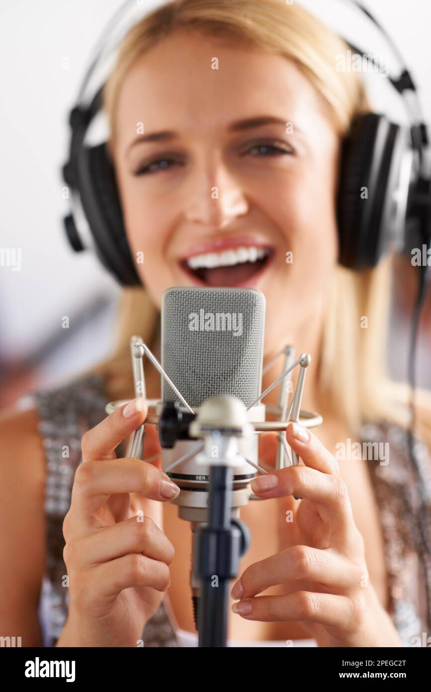 Beautiful blonde woman singing microphone hi-res stock photography and ...