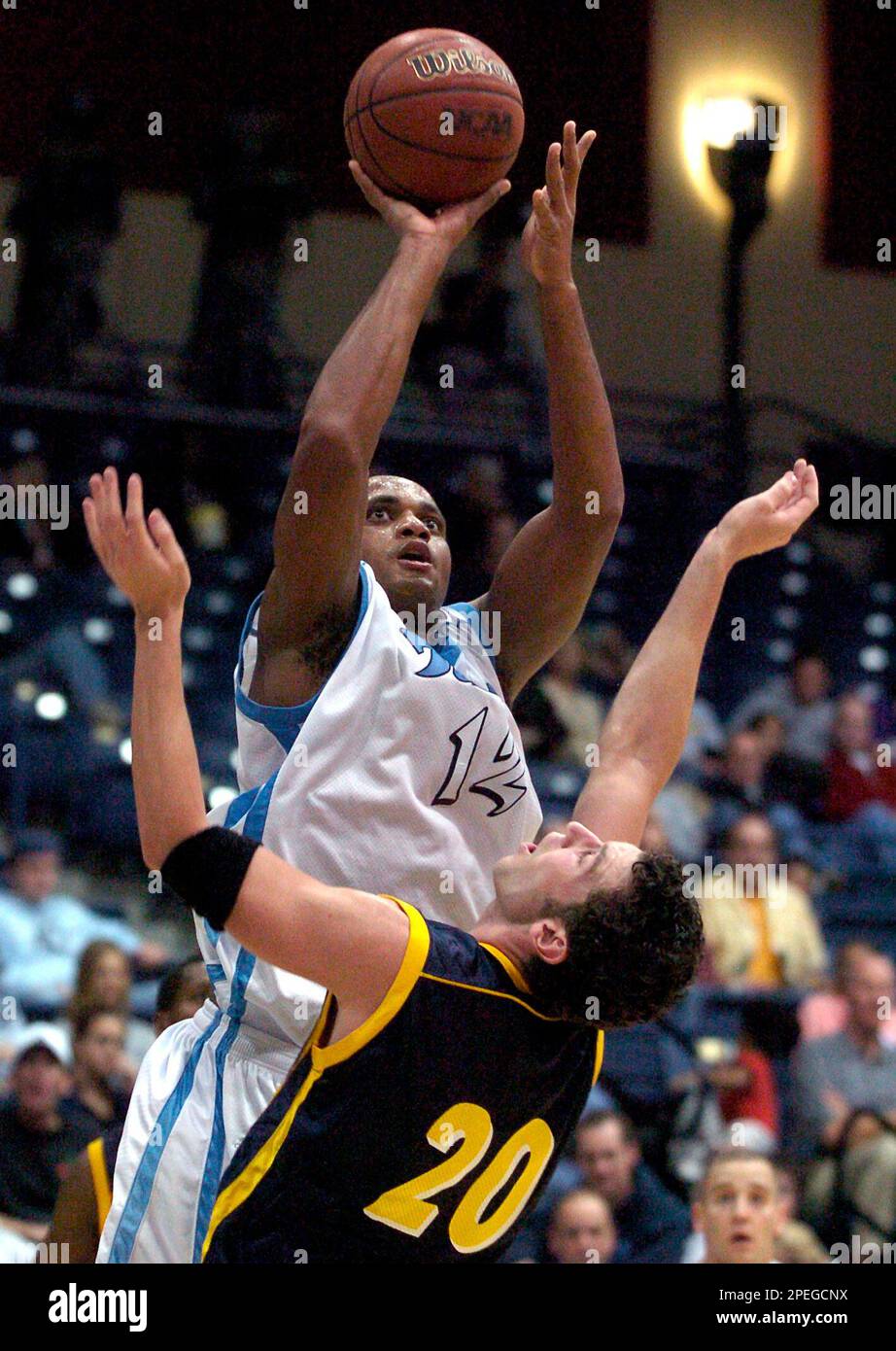 San Diego's Brice Vounang (12) shoots over UC Santa Barbara's Cameron ...