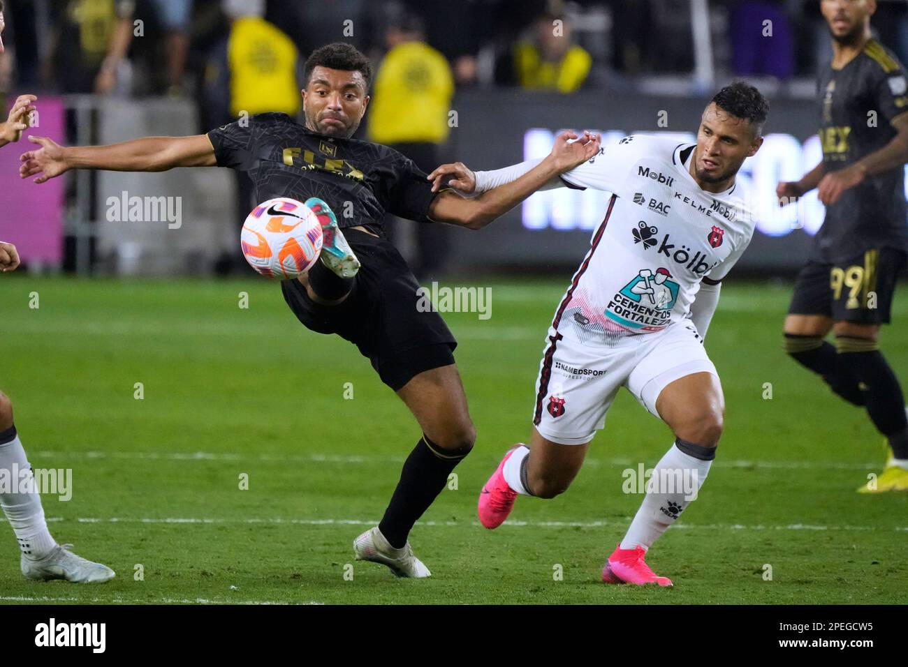Los Angeles FC's Timothy Tillman, left, reaches for the ball next to ...