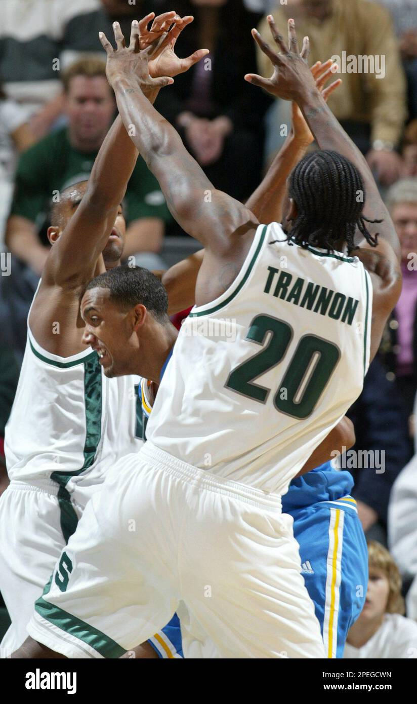 UCLA's Dijon Thompson, center, looks for help against pressure from ...