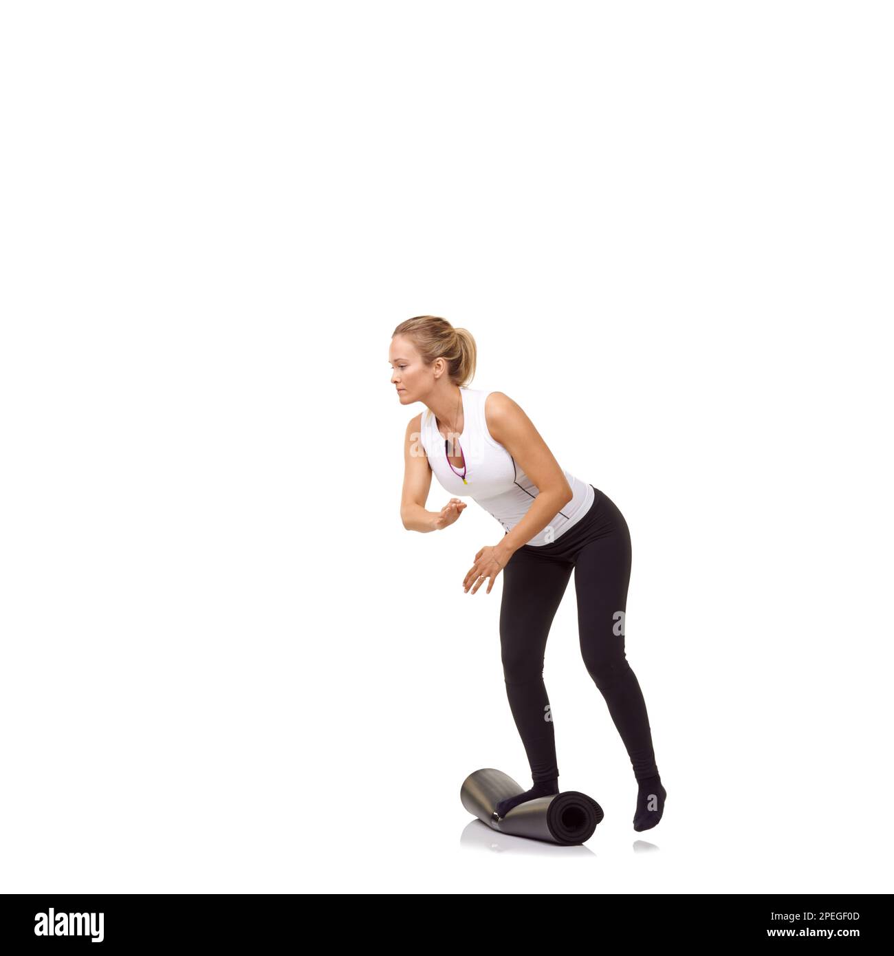 Keeping her movements precise. A pretty young woman balancing on her ...