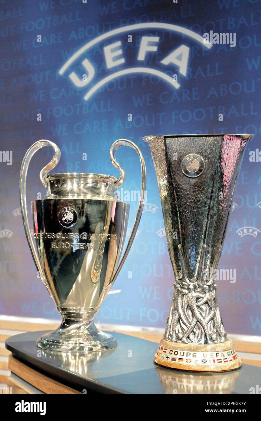 The UEFA cup, right, and the Champions League cup, left, are ...