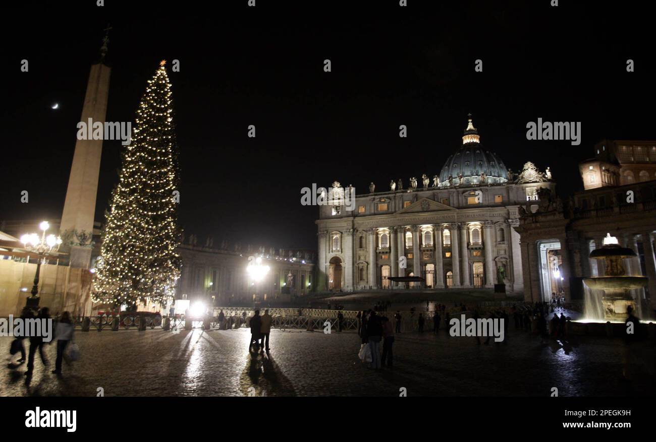 The pope's Christmas tree, at left, is seen in St. Peter's Square at ...