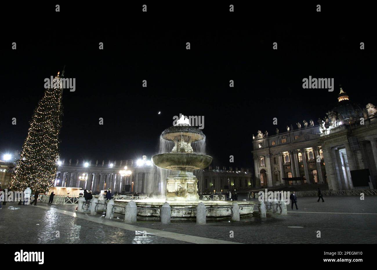 The pope's Christmas tree, at left, is seen in St. Peter's Square at ...