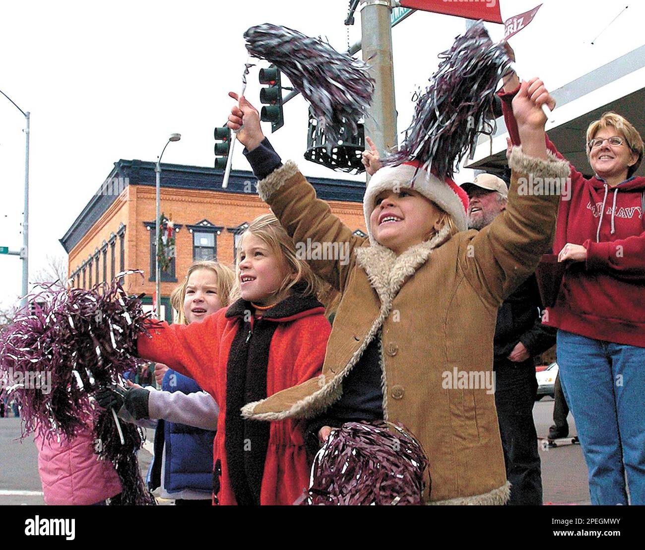 Lake Duerksen, Addison Scott and Anna Billet, from right, cheer as the ...
