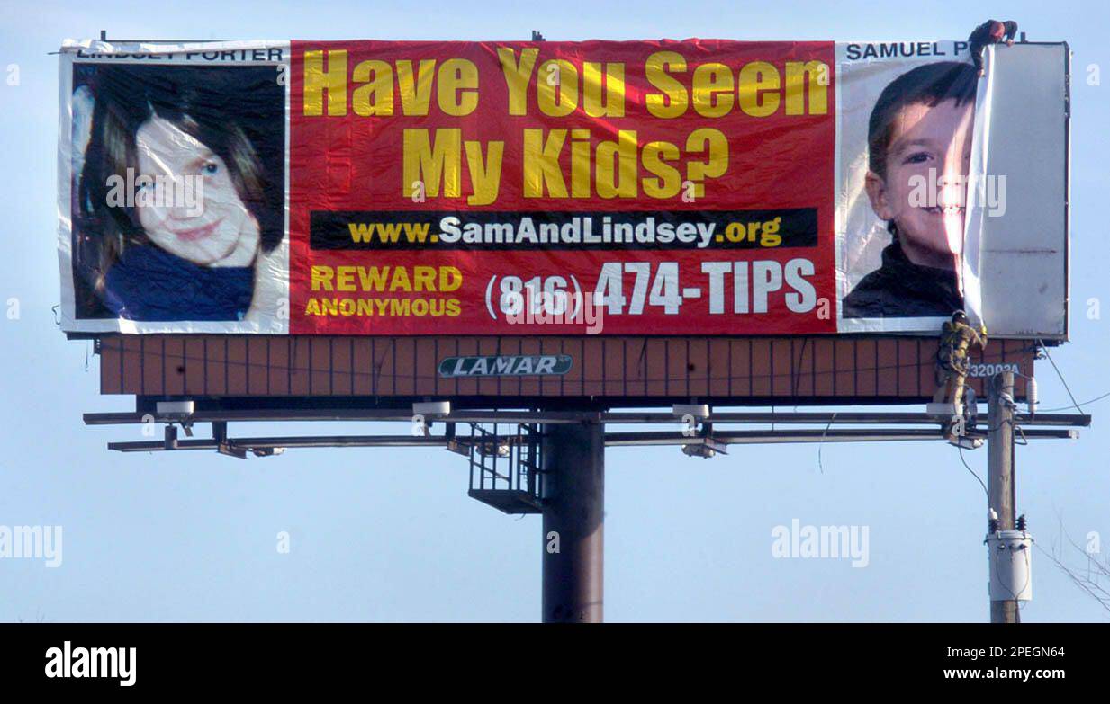 A billboard with the faces of Lindsey and Sam Porter is seen Wednesday ...