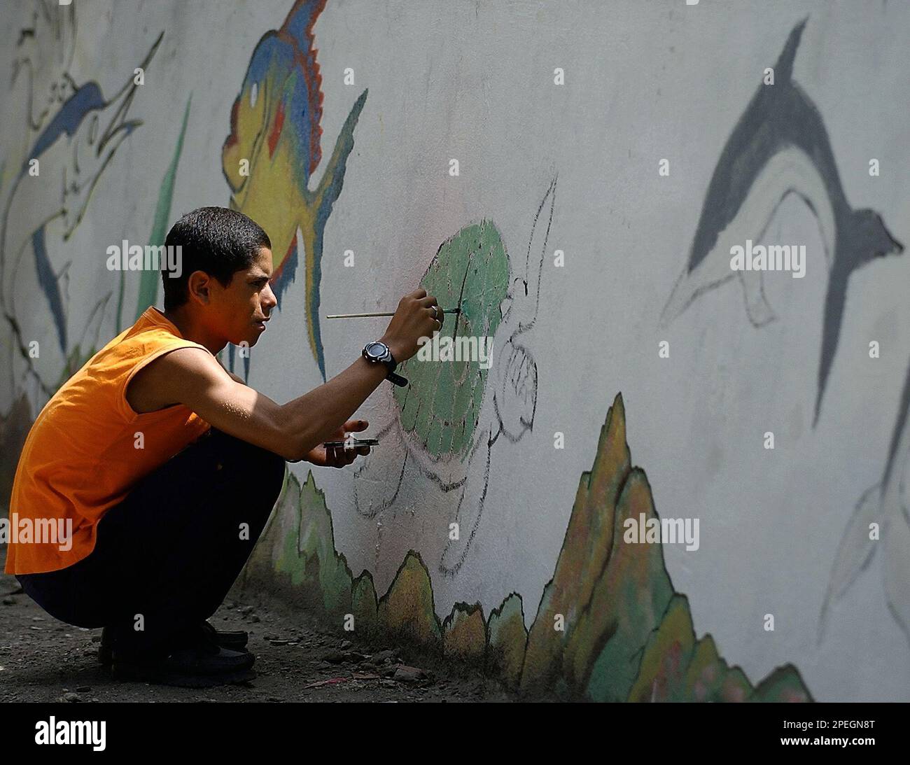 A student whose school was destroyed in mudslides paints a mural with ...