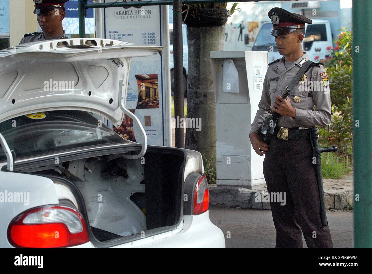 Indonesia Police officers guard during security check at the entrance ...