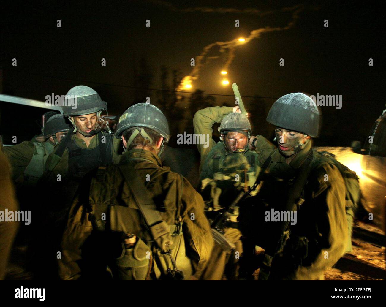 Israeli soldiers at the entrance of the Israeli checkpoint of Kerem ...