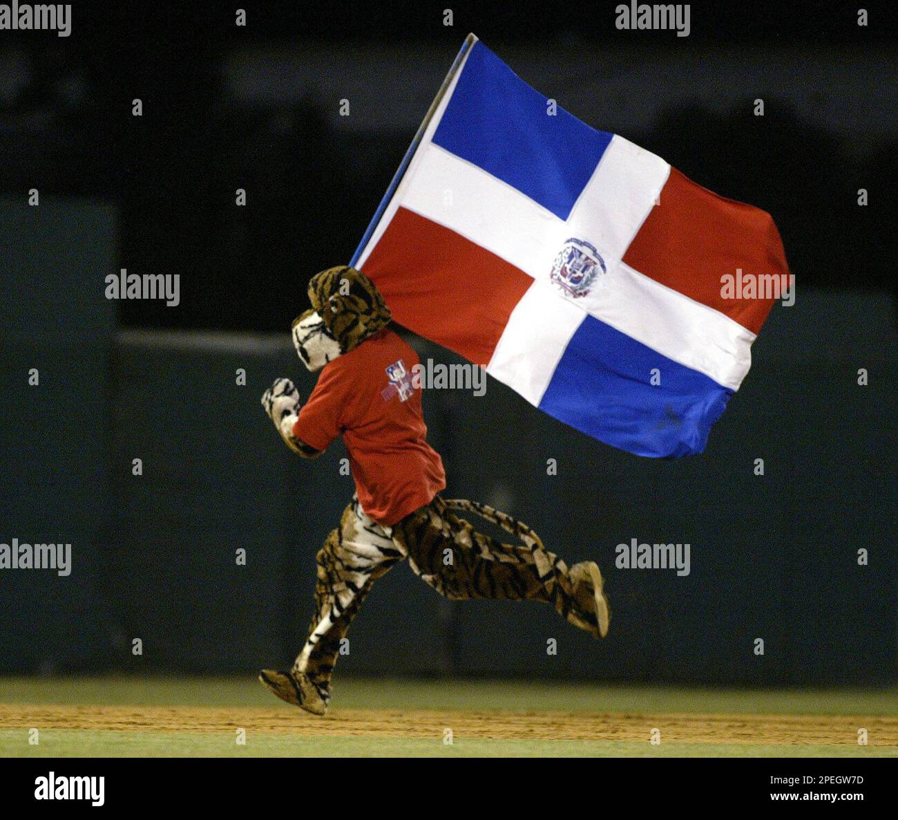 The Domincan teams mascot runs around the bases after Dominican beat ...