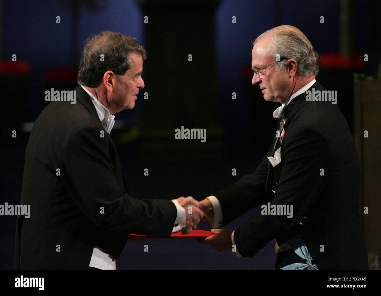 Aaron Ciechanover of Israel, left, receives the Nobel Prize in ...