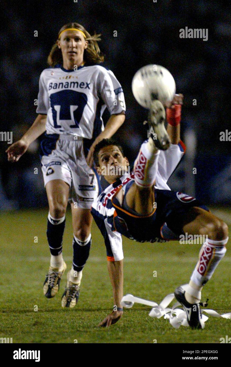 Monterrey soccer player Pablo Serafin, front, controls the ball as ...