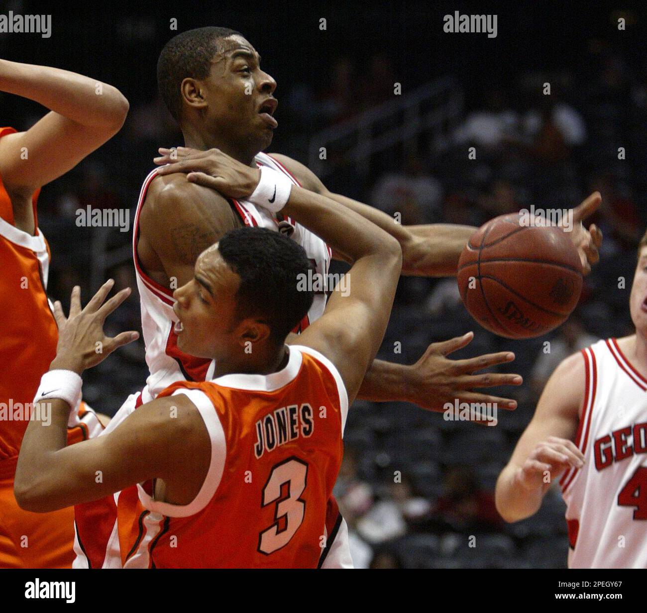 Georgia's Levi Stukes drives into Oregon State's Marcel Jones (3 ...