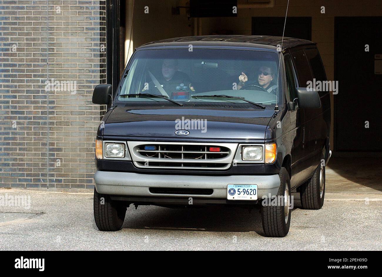 A state van with Michael Ross aboard leaves Superior Court in New ...