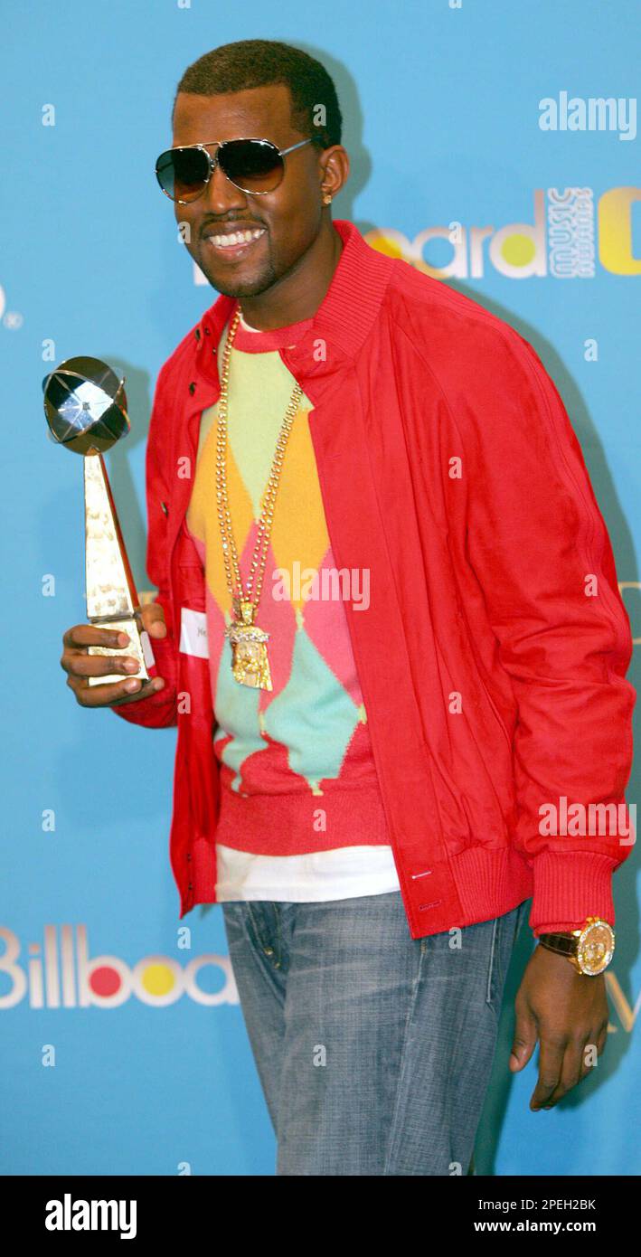 Kanye West poses with his award during The 2004 Billboard Music Awards ...