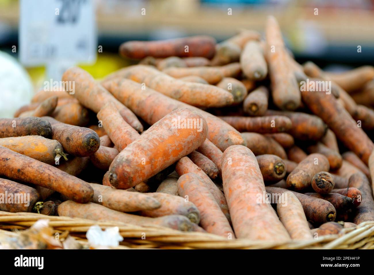 Sale of carrots in a grocery hypermarket. Pile of carrots background ...