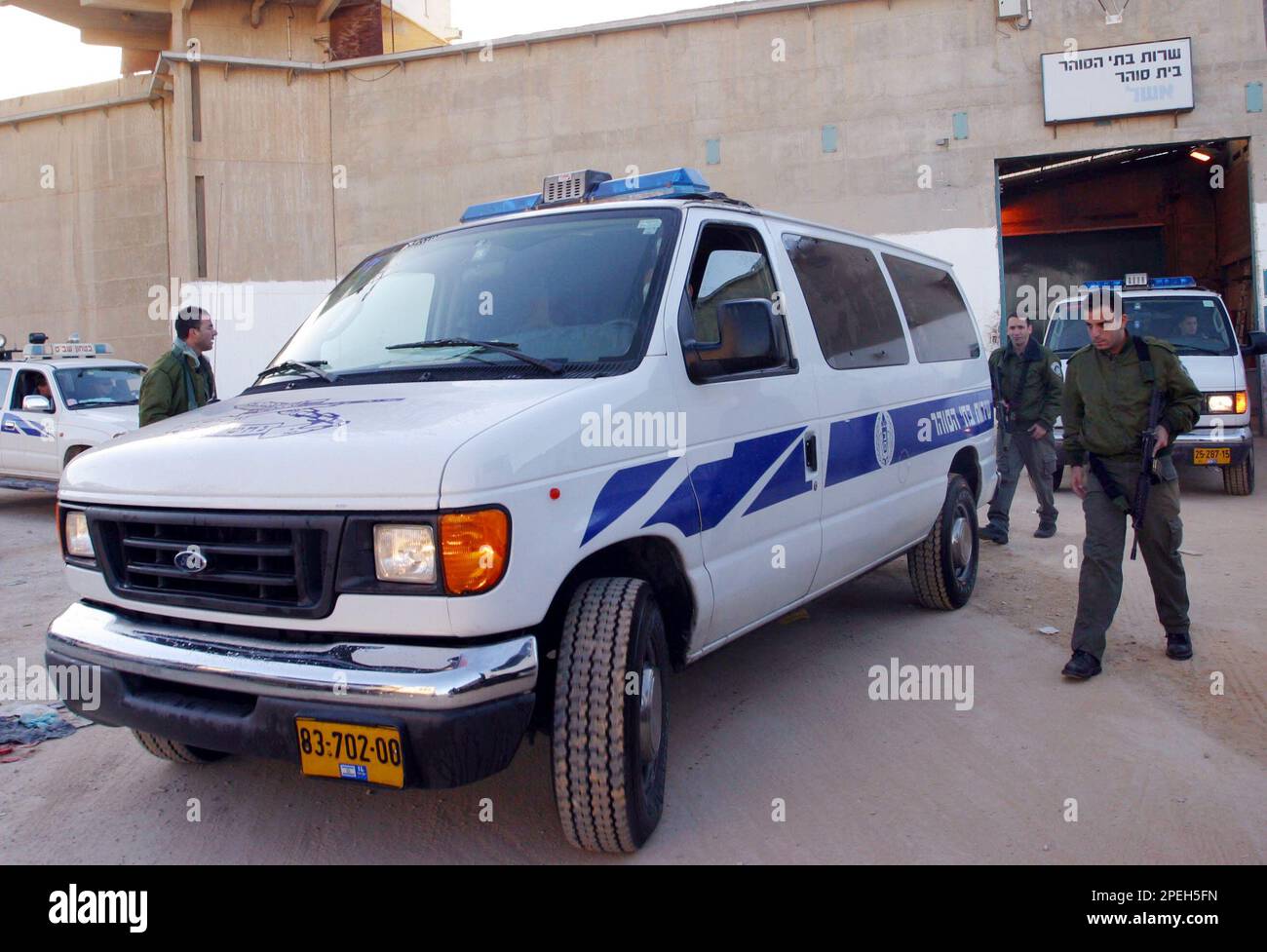 Israeli border police officers guard a van carrying Egyptian student ...